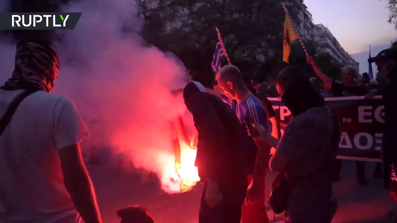 Greek protesters burn Turkish flags decrying Hagia Sophia's ...
