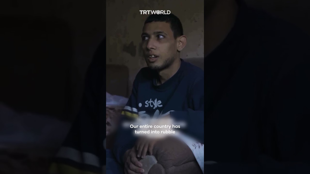 Displaced father in Gaza carries two special needs children amid war ...