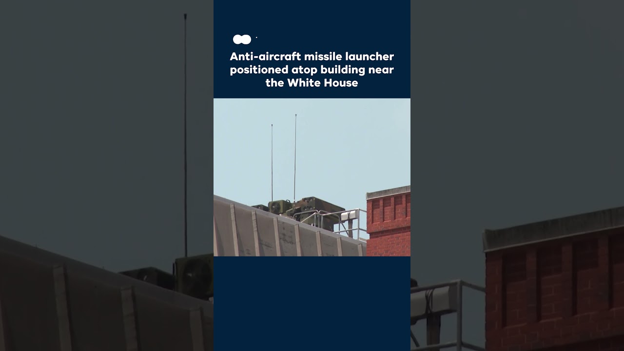 Anti-aircraft missile launcher positioned atop building near the White ...