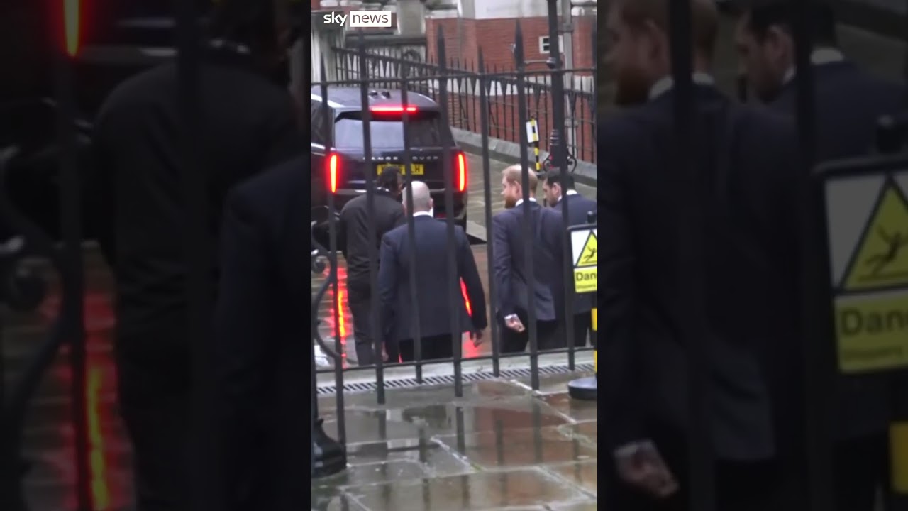 Prince Harry smiles leaving court - World News